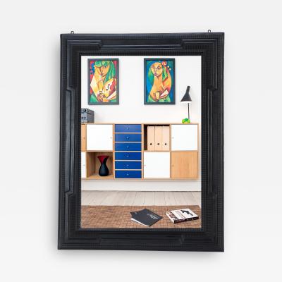 A Large Dutch style ebonIzed frame with ripple carving. Circa 1940.