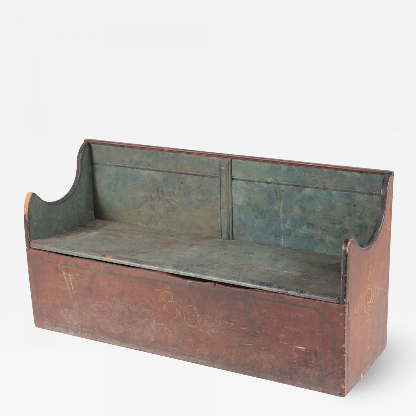 An early nineteenth century paint decorated wood lift lid storage bench.